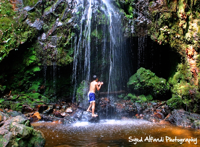 The cave beneath the waterfall.