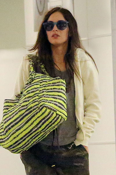 Megan Fox hides growing up belly from the paparazzi