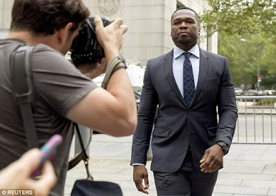 50 Cent goes from a D&G 3-piece suit to a plain gray as he appears in court