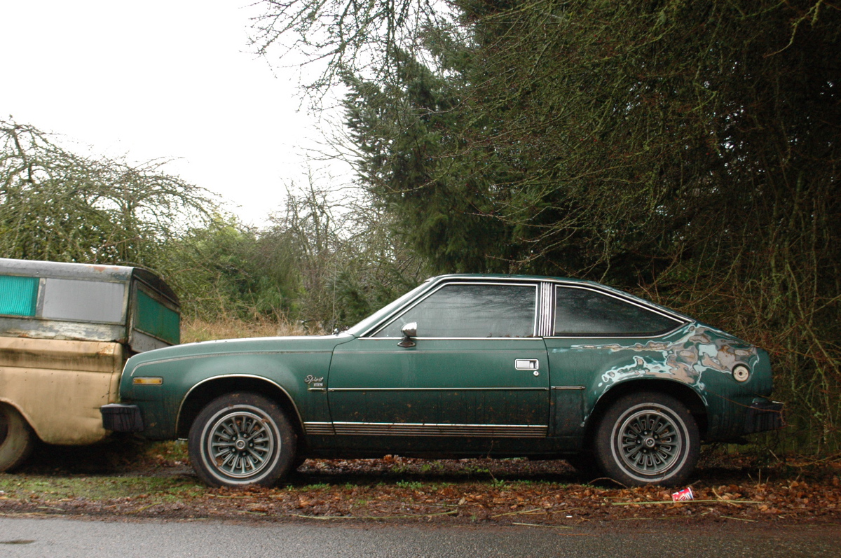 OLD PARKED CARS.: 1982 AMC Spirit DL hatchback.
