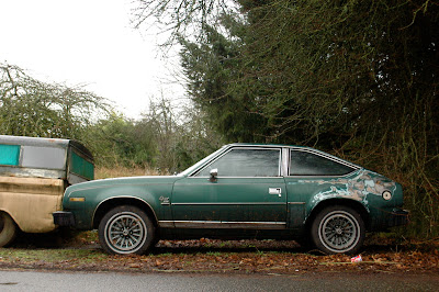 OLD PARKED CARS.: 1982 AMC Spirit DL hatchback.