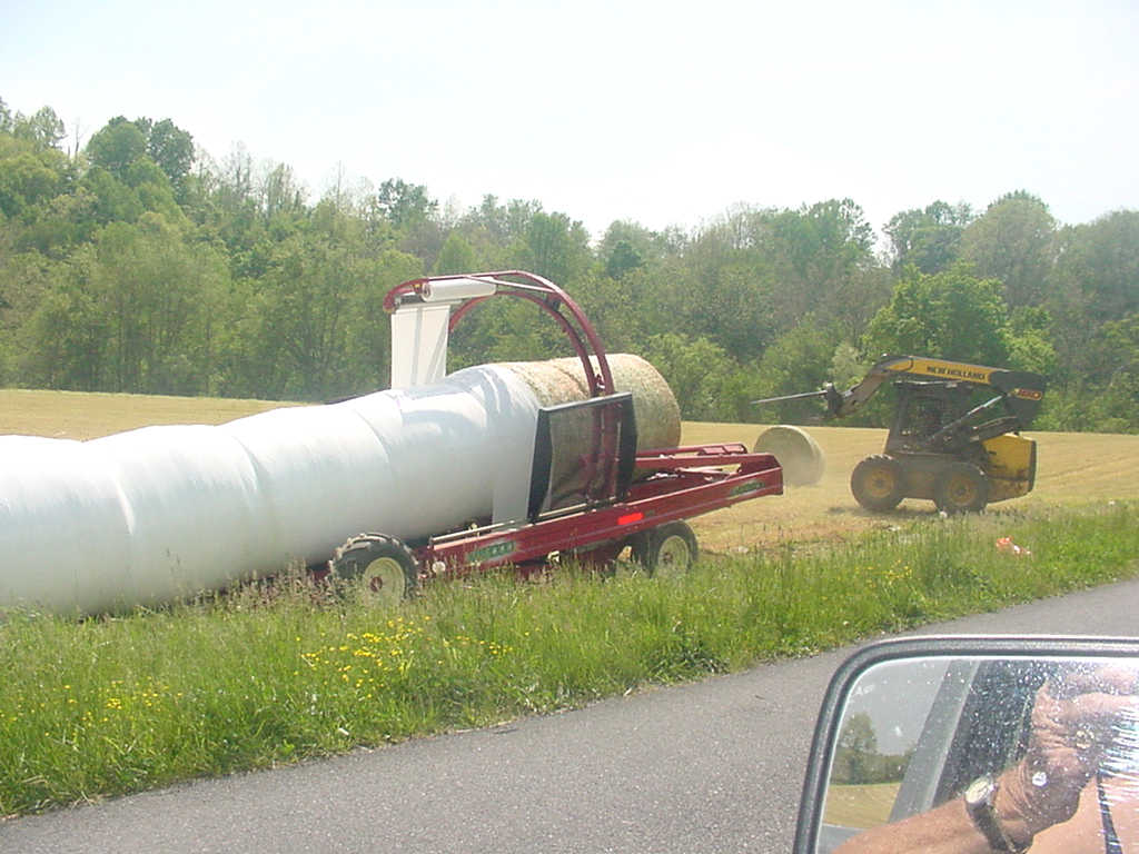 Gardening along the creek...: Long White Worm of Hay Bales
