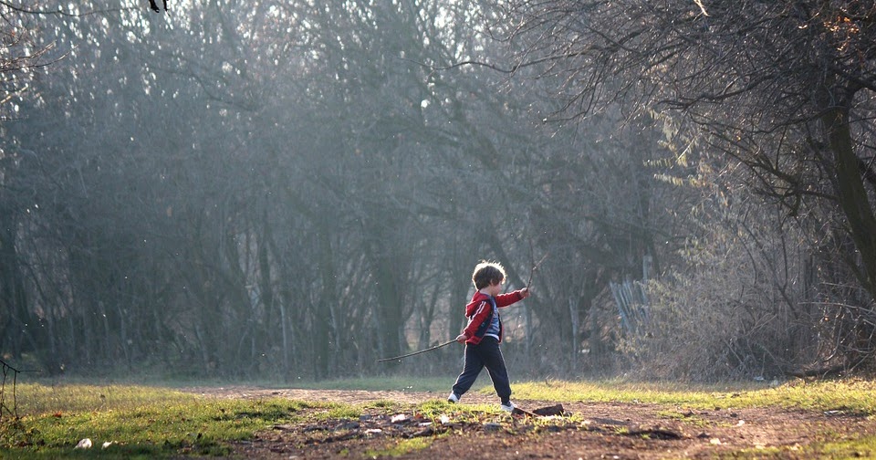 Small child moving in nature