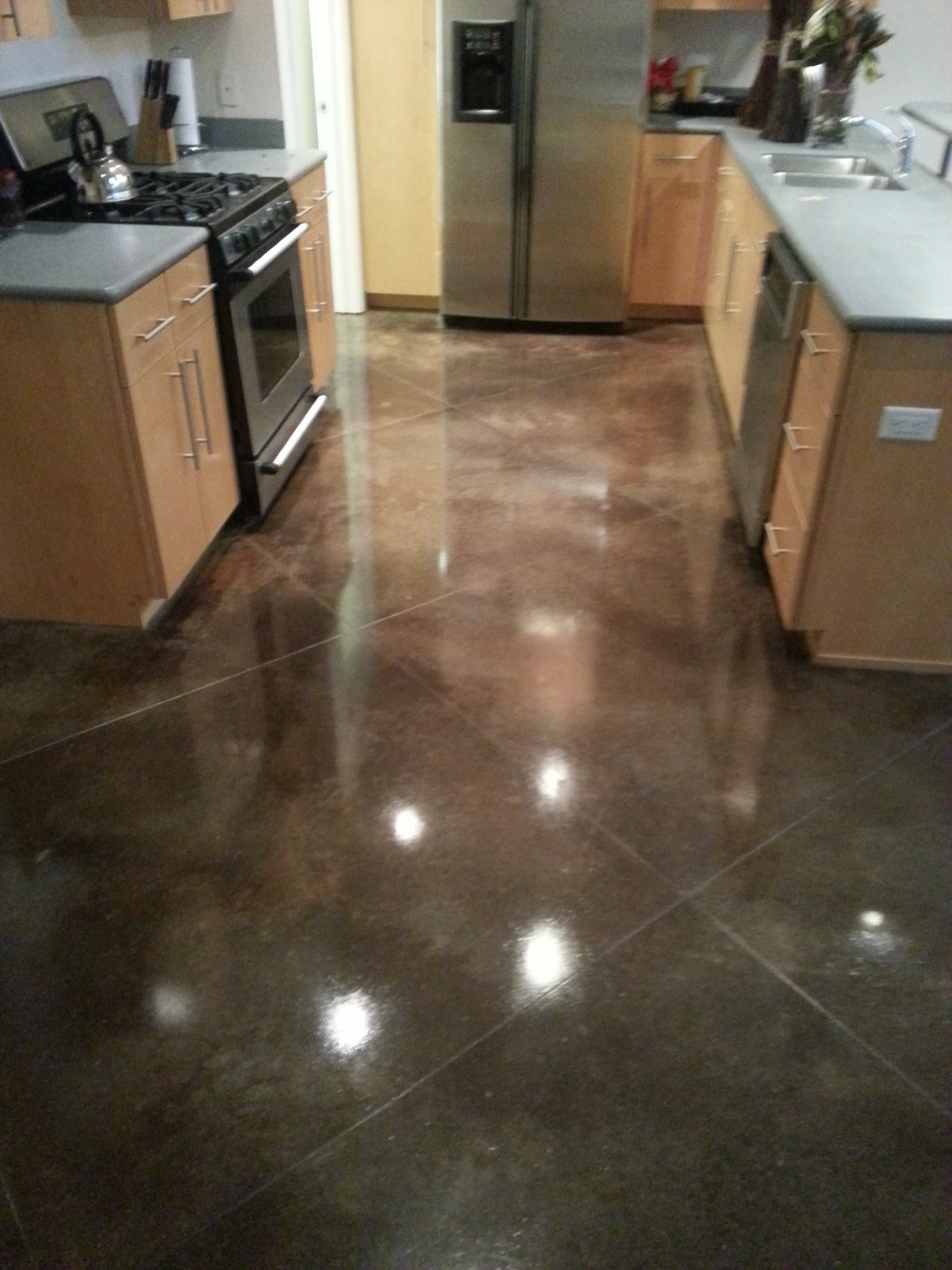 Epo- Floors: Waxed and buffed stained concrete