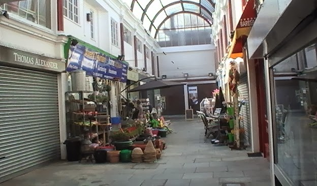 Andrew Simpson: The Arcade in the High Street in Eltham