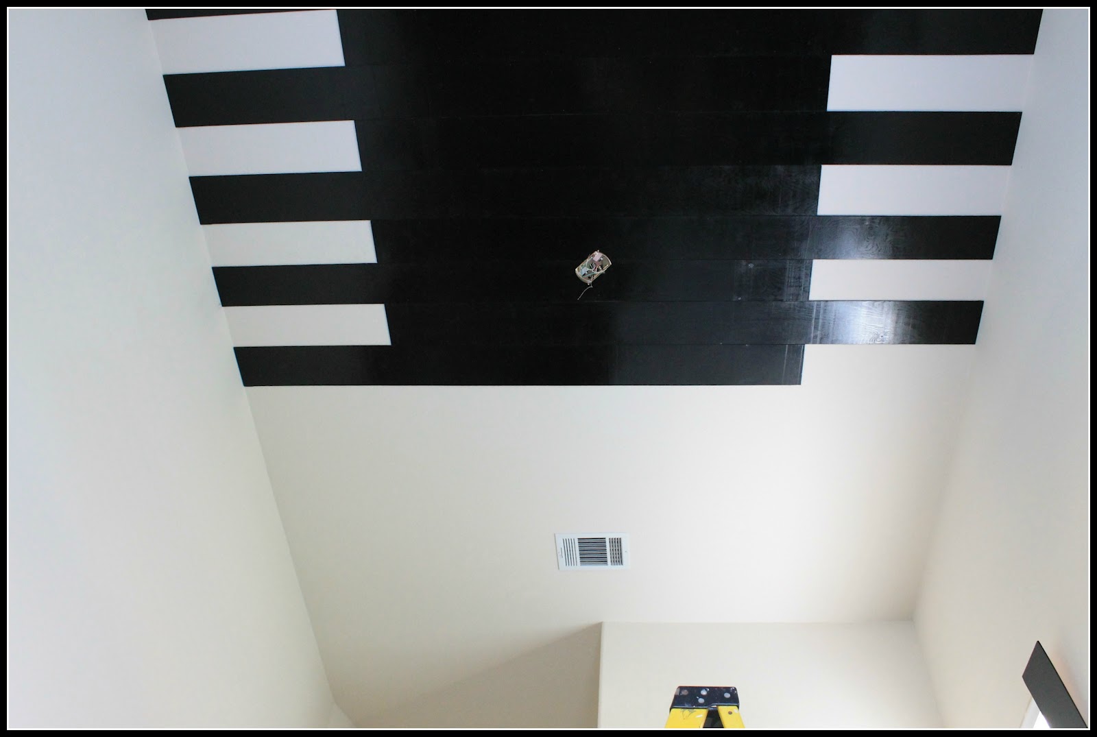 Make Them Wonder: Glossy Black Plank Ceiling