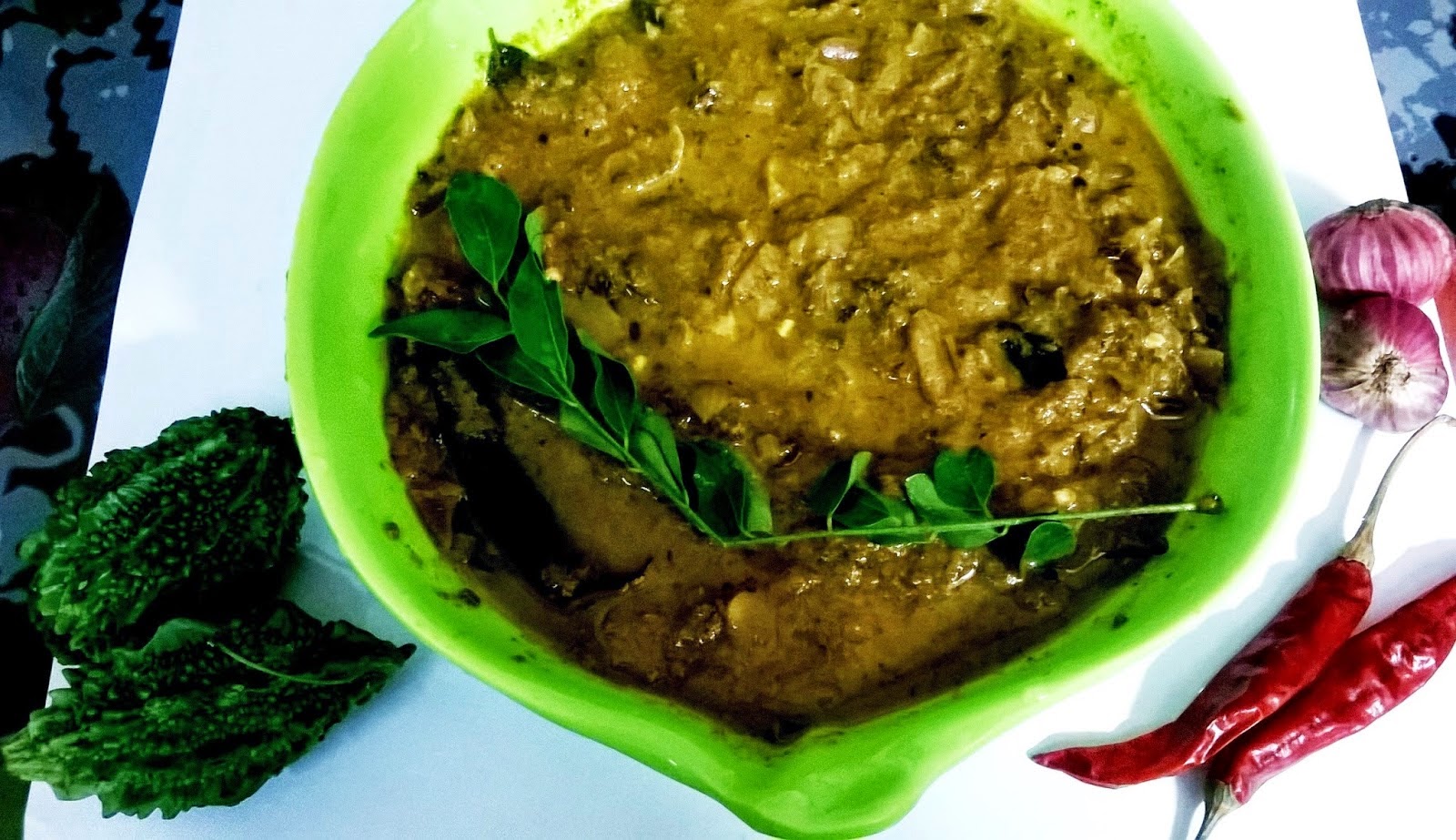 Pavakka Theeyal (Bitter Gourd and shallots cooked in spicy roasted ...