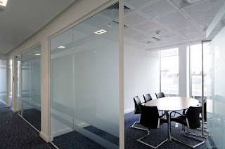 Sand blasted glass partition for conference room