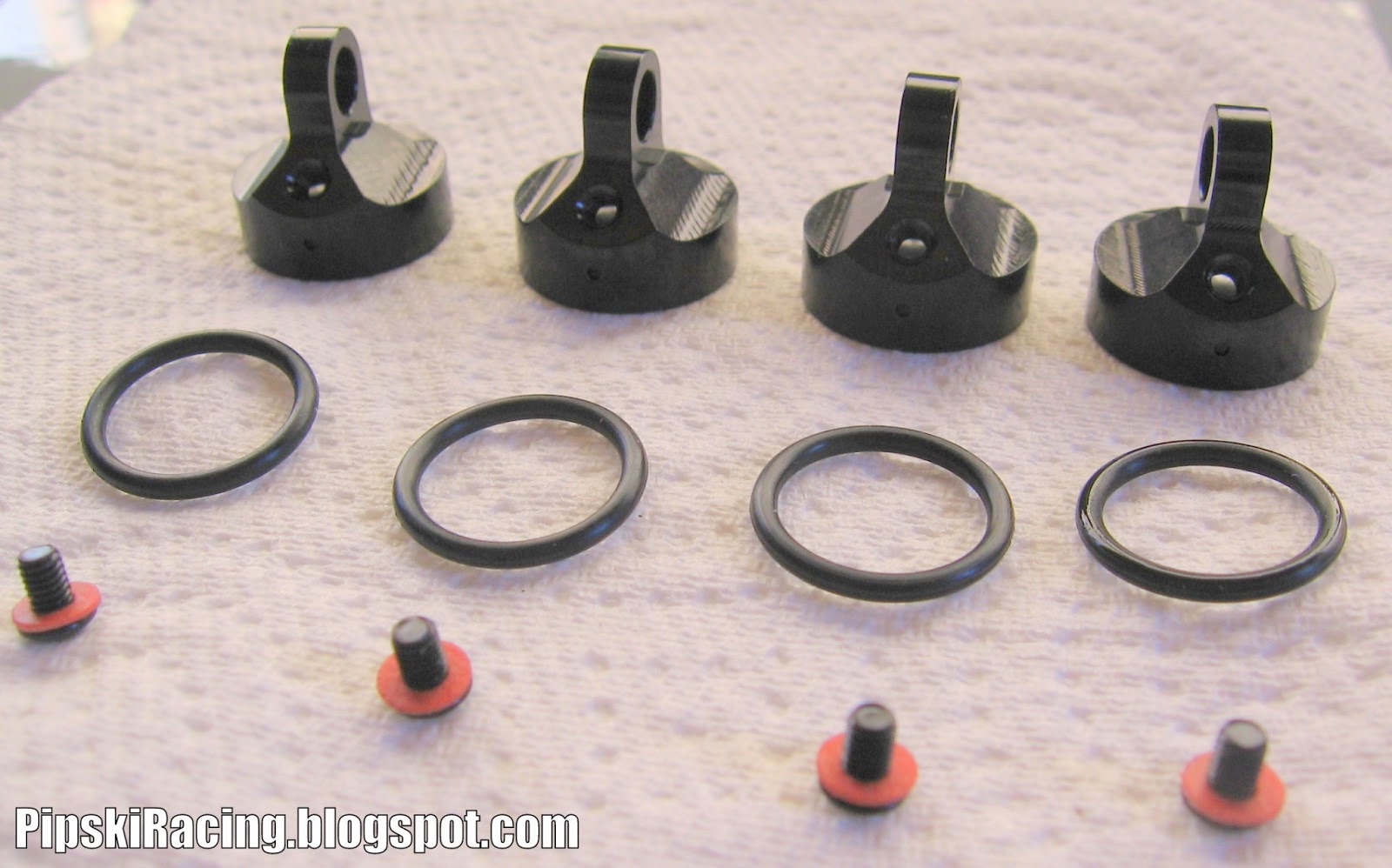 Pipski Racing: Schumacher Big Bore Vented Shock Caps.