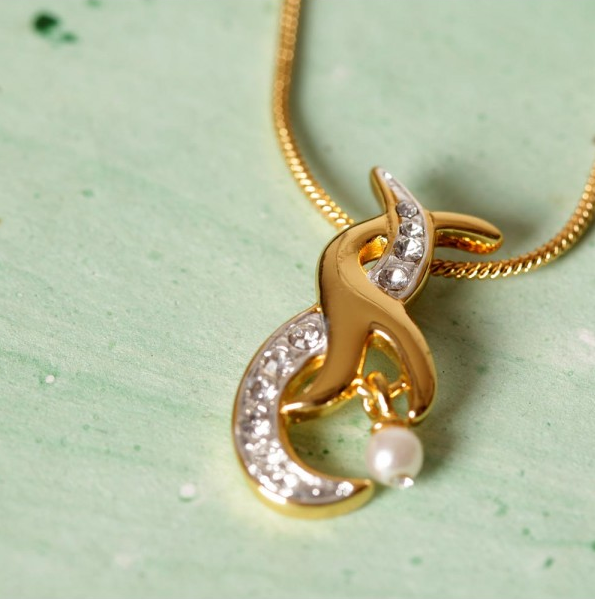 “Simplicity is the keynote of all true elegance.” : Gold Pendants For Girls