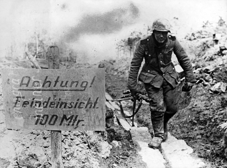 Asian Defence News: A soldier of the SS Norwegian Legion walks past a ...