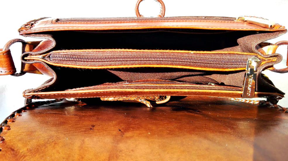 brandylovesvintage: vedasto: convertible tooled leather bag