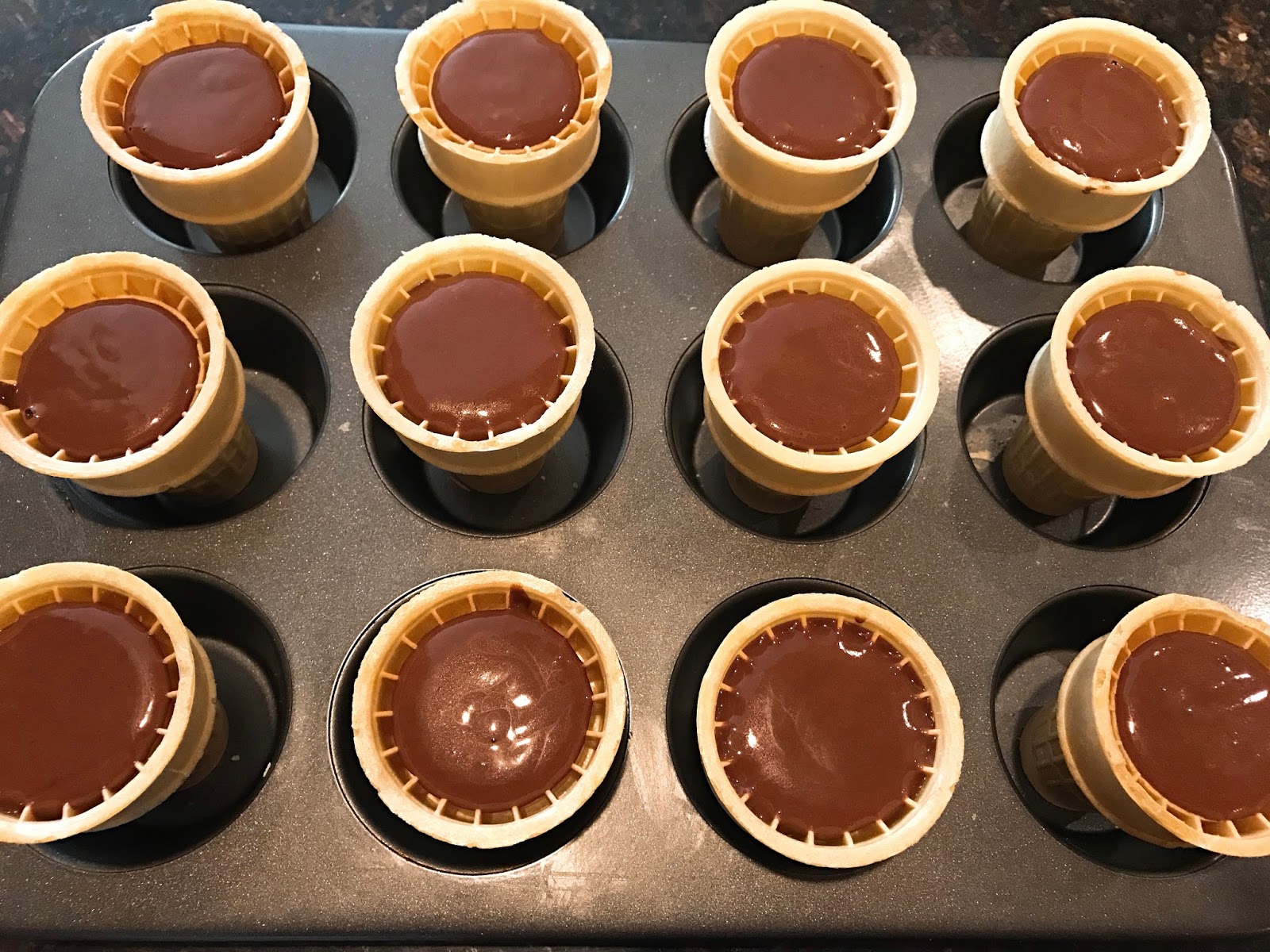 Overflowing Chocolate Cake Cups with Vanilla and Strawberry Icing