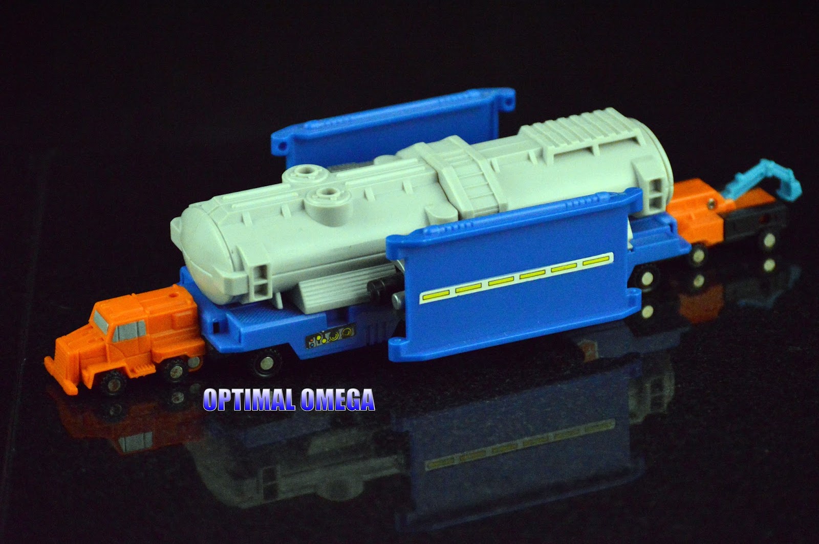Optimal Omega's Transformers: Micromaster Tanker Truck Combiner Transport
