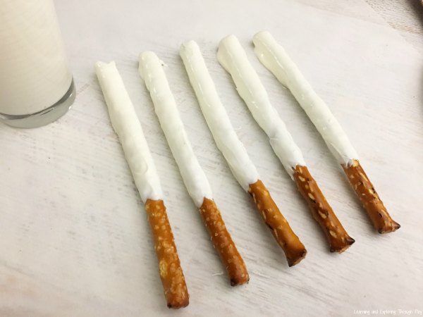 Learning and Exploring Through Play: Snowman Pretzel Rod Snacks