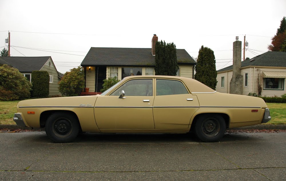 OLD PARKED CARS.: 1974 Plymouth Satellite Custom.