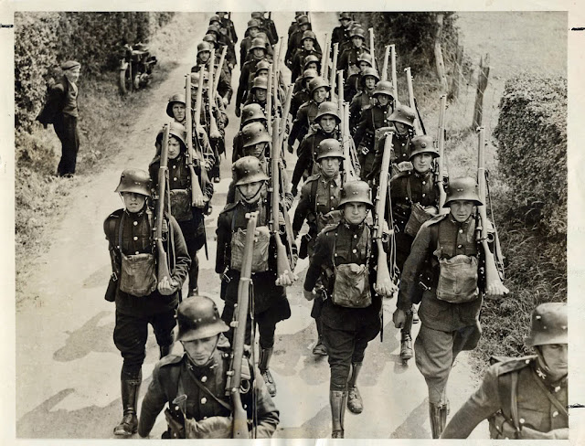World War II History: A column of Irish soldiers on the march, early ...