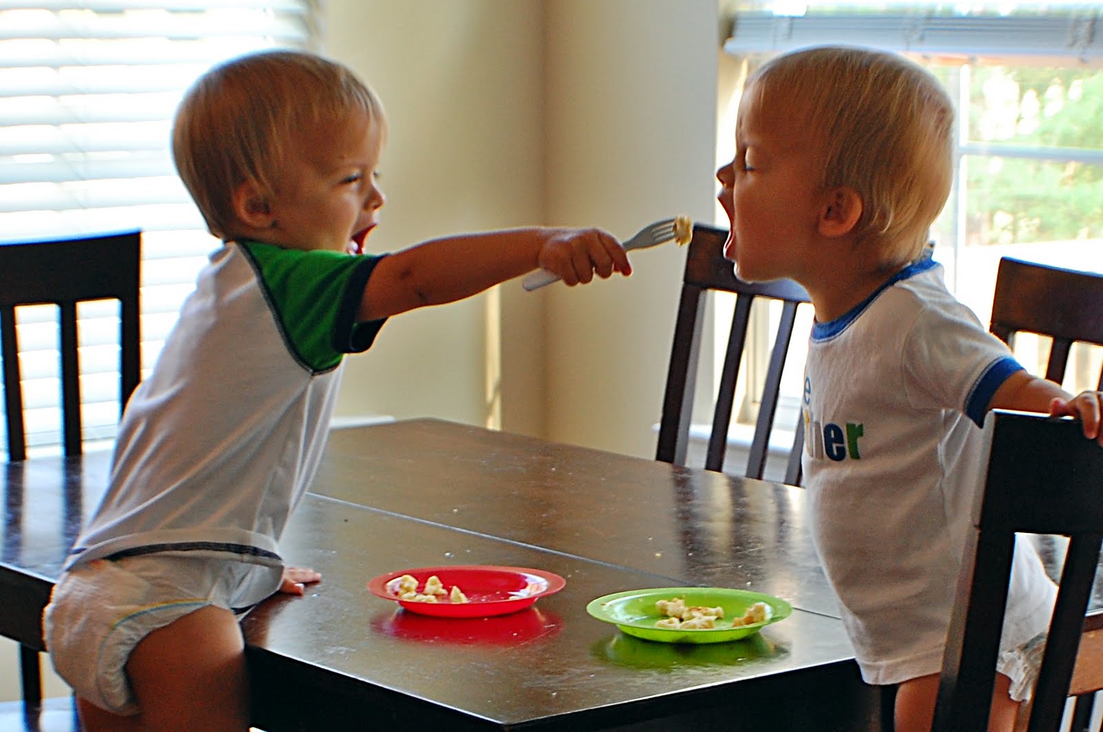 Our Growing Family: My kids like to feed each other...