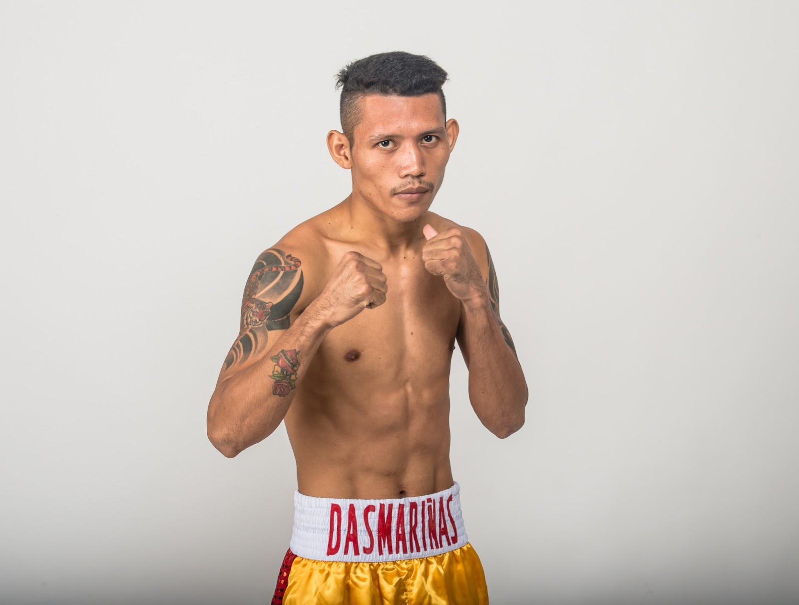 Photo Caption: Filipino fighter Michael Dasmarinas in top form, and ...