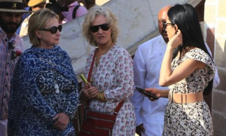 It takes a village: Hillary Clinton layers a scarf, shawl and custom ...
