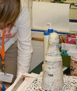 Mrs. Macre's Art Class: Up to our Elbows in newspaper, tape, and Plaster.