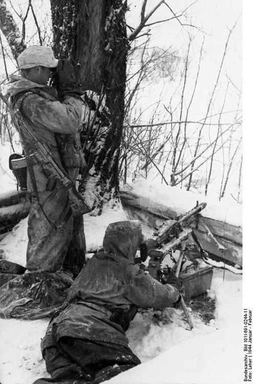 World War II History: Two German soldiers in position with a MP 43 ...