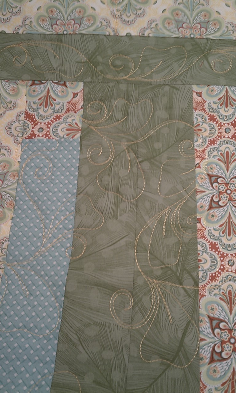 Jelly Roll 1600 quilt up on the frame