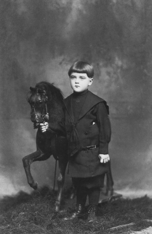 Old Fashioned Kids With Large Toy Horses | sweet juniper inspiration