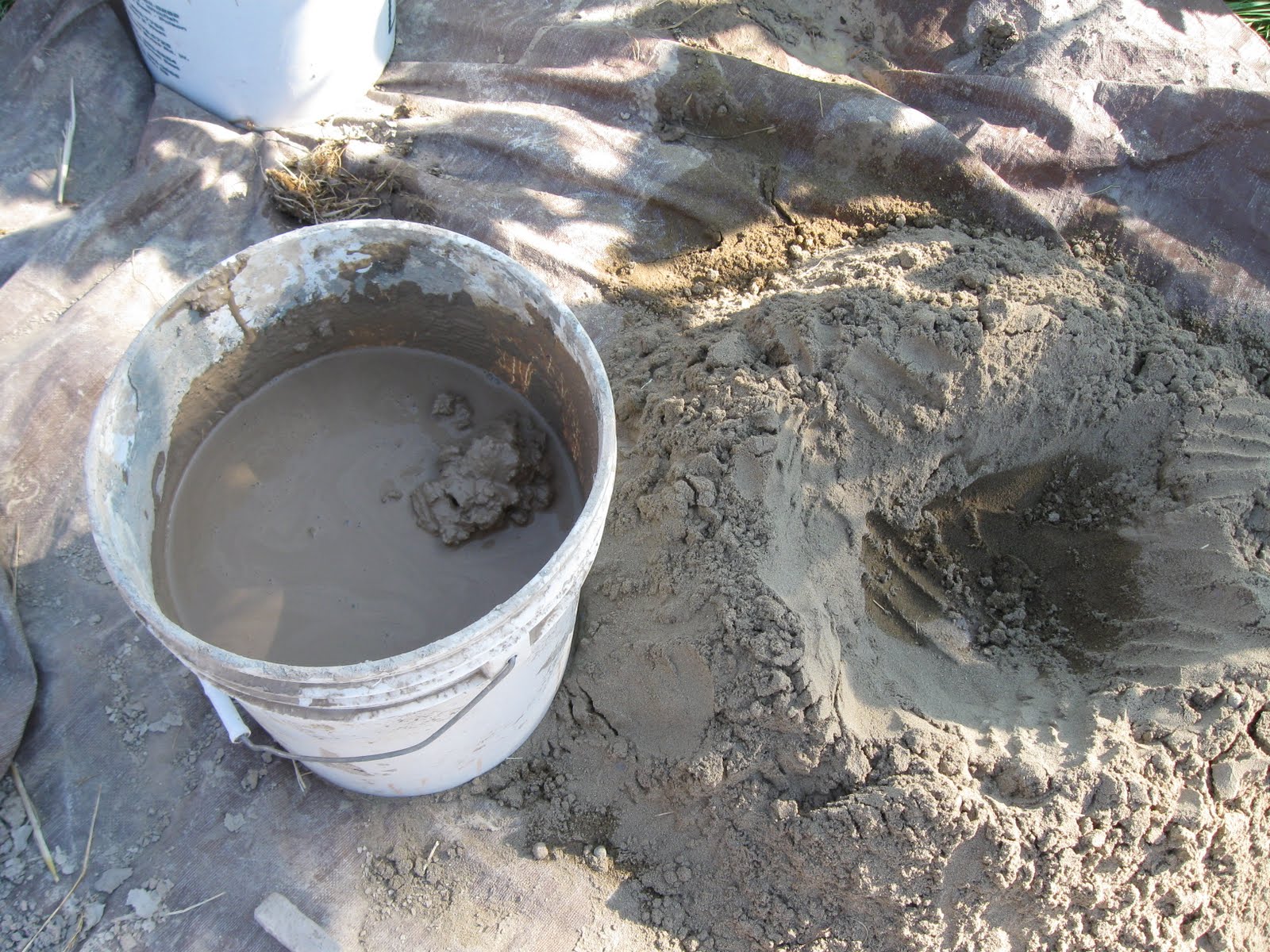 Squash Blossom Farm: First Coat of Earth Plaster