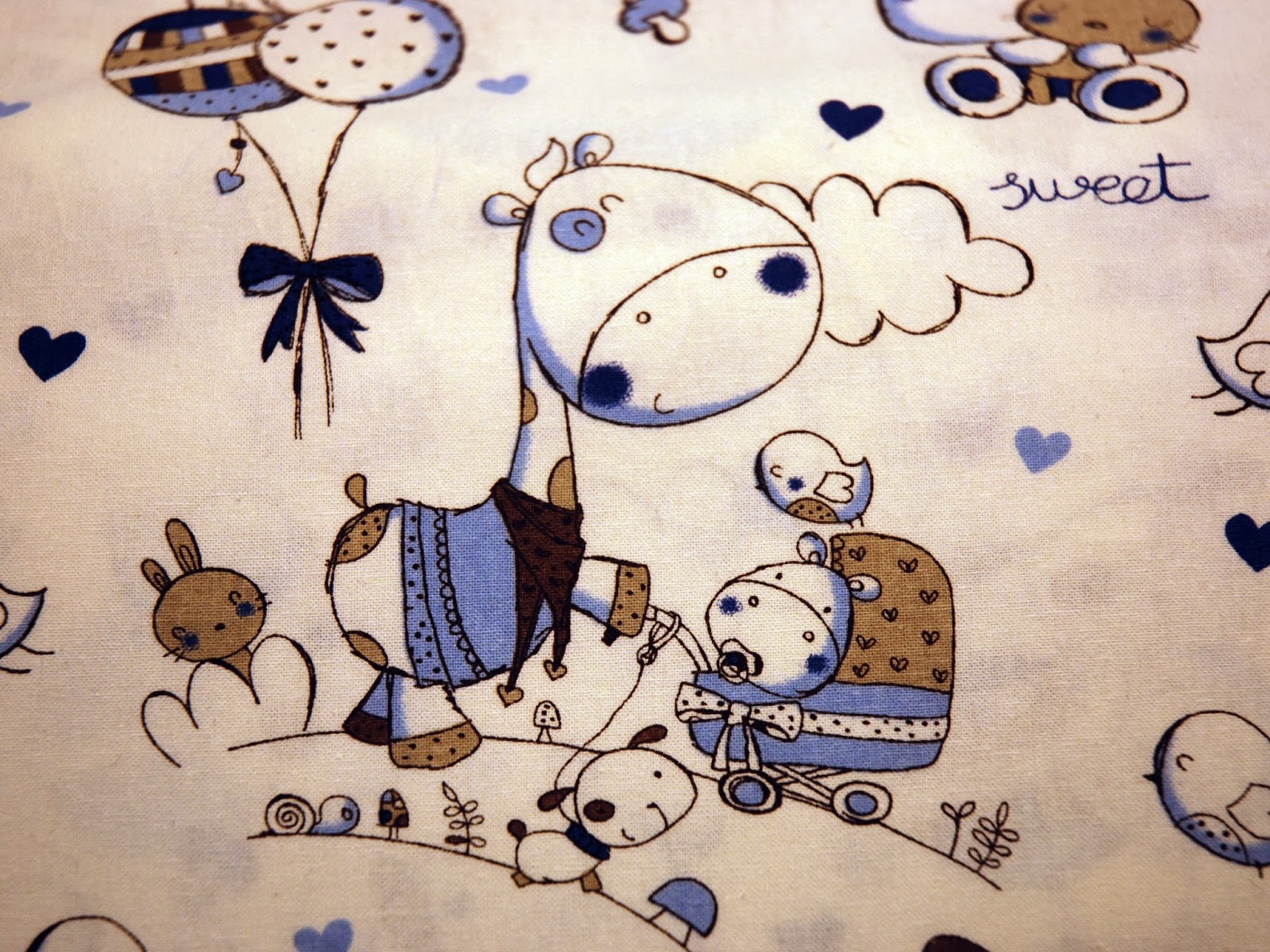 Bocinets d'encís: Telas de bebé y una canastilla