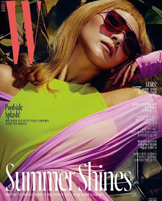 CL poses poolside for the cover of 'W' magazine