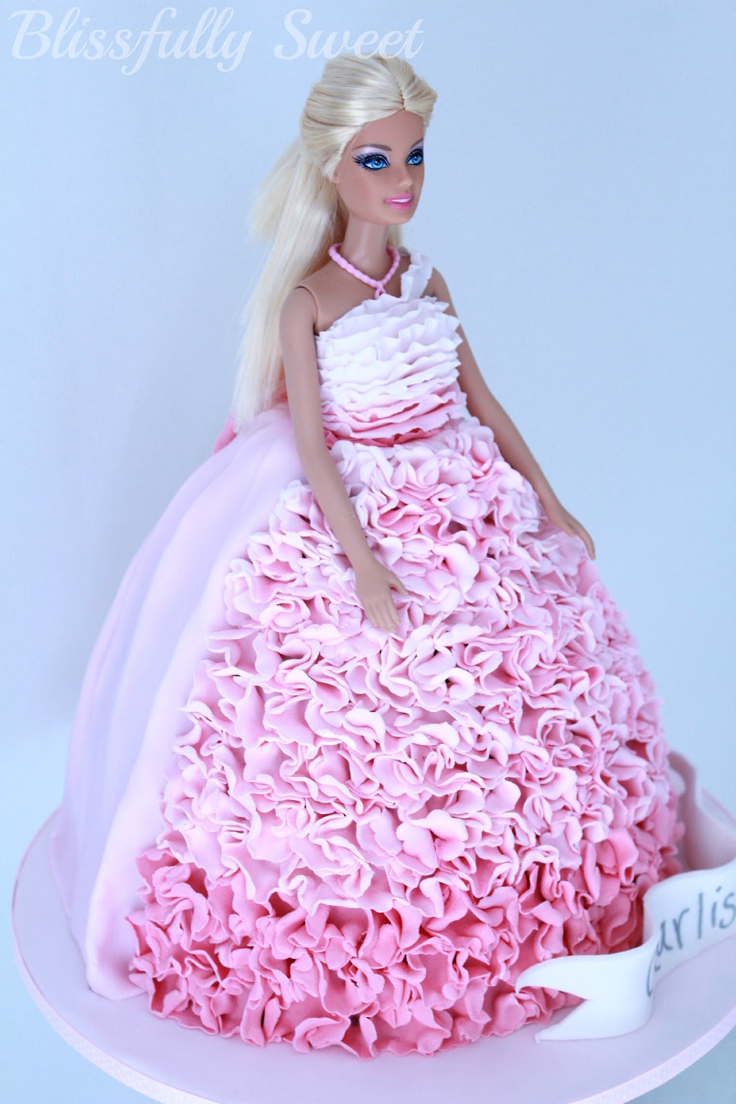 Blissfully Sweet: An Ombre Pink Ruffled Barbie Birthday Cake