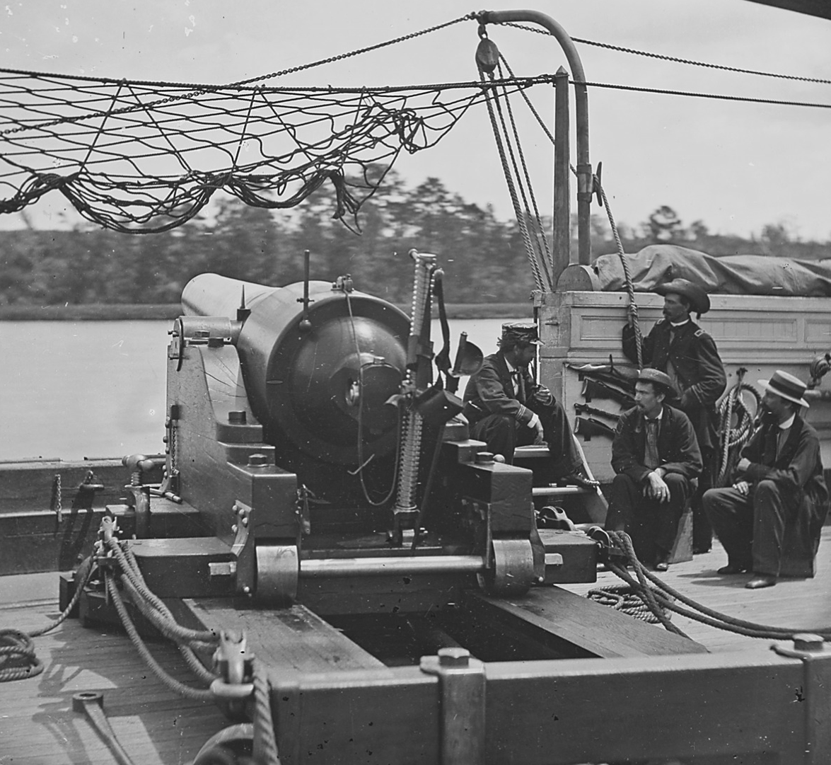 Union sailors posing next to a cannon on the deck of an unidentified ...