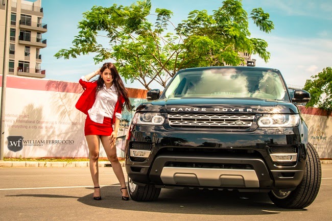 Rebellion office girl poses with Range Rover Sport | Carsfresh
