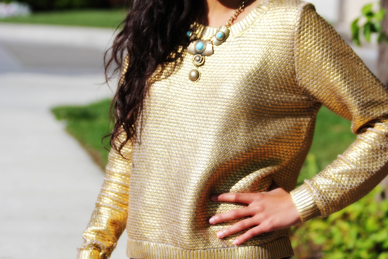 Unconfined Aspirations: Gold sweater.