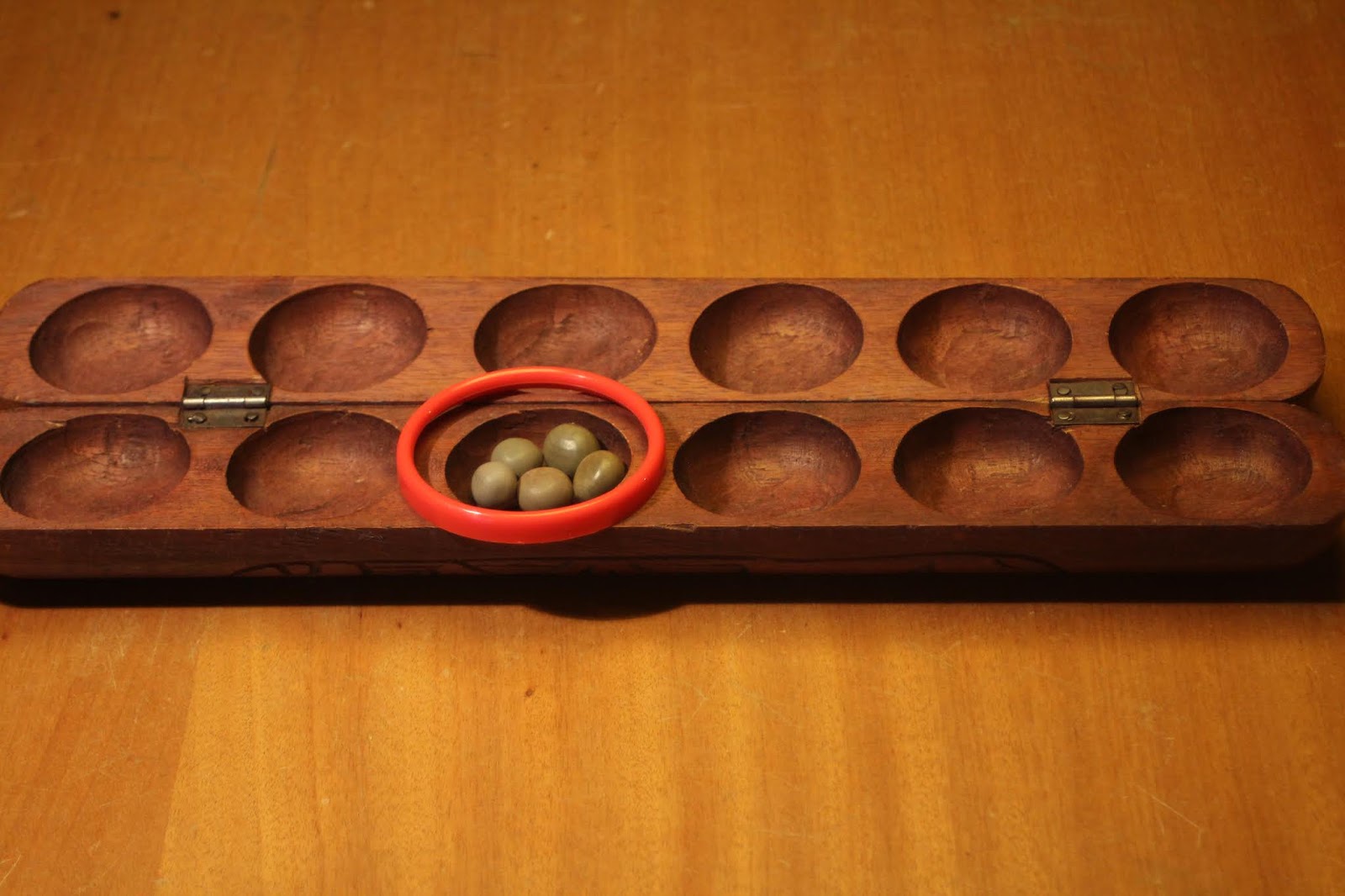 In Black and White: How to play: Mancala