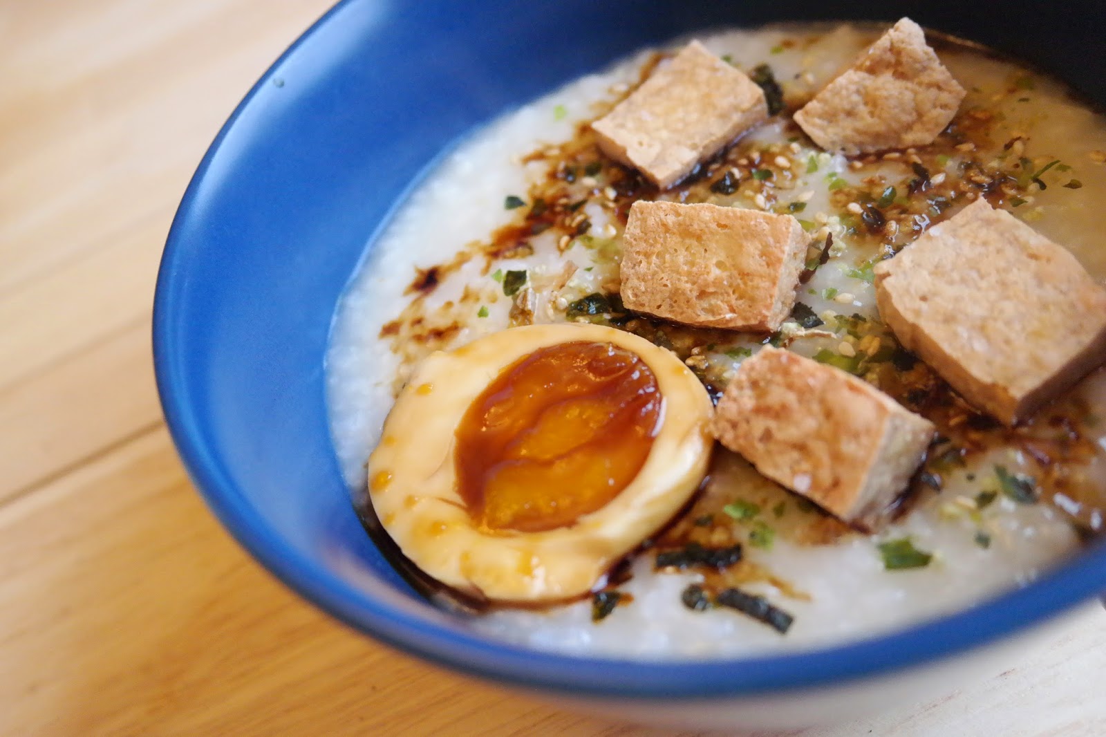 Rice Porridge, Congee with ajitama egg, fried tofu, furikake, and Maggi ...