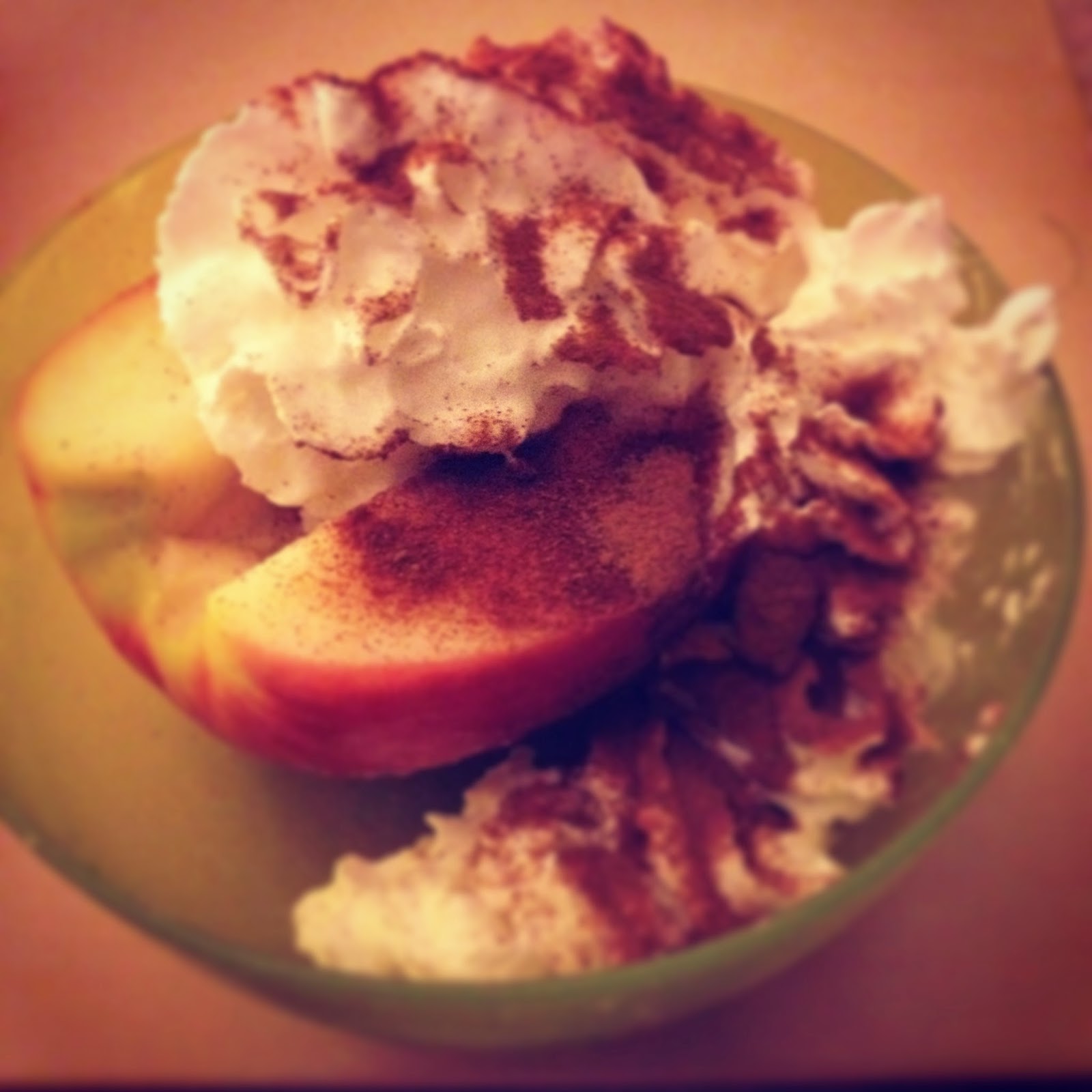 Poached apple with cinnamon and whipped cream