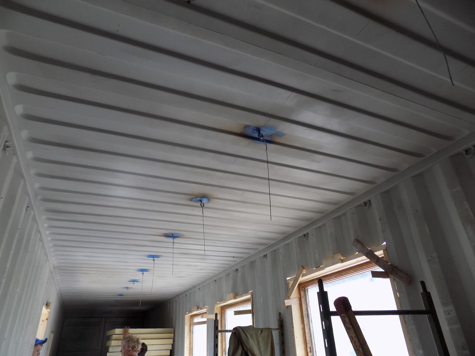 Intermodal House: Strapping on, Windows in, Insulation, Siding Mostly on