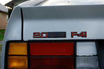 OLD PARKED CARS.: 1984 Chevrolet Cavalier F-41 and 1961 Chevy Impala.