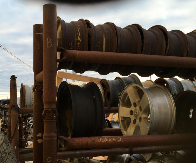 Just A Car Guy: Check out the cool rim racks at the scrap yard!