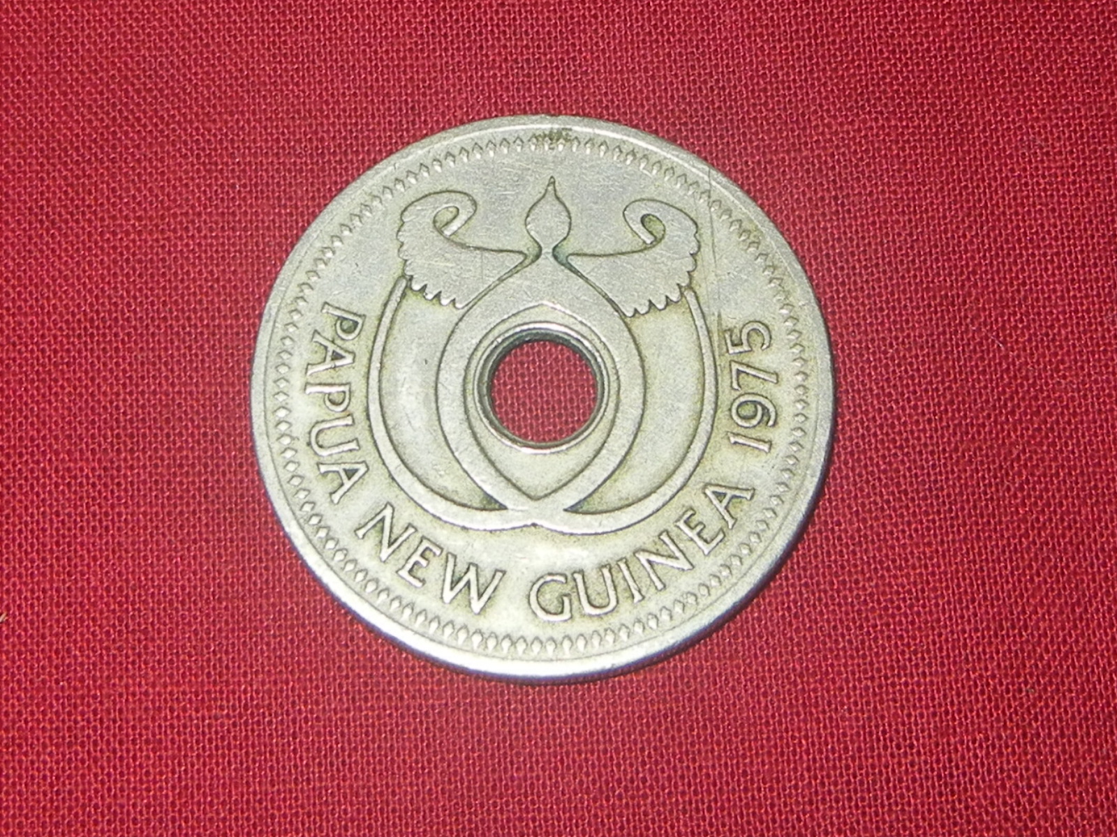 GELIGA KINABALU: DUIT SYILING PAPUA CAP BUAYA