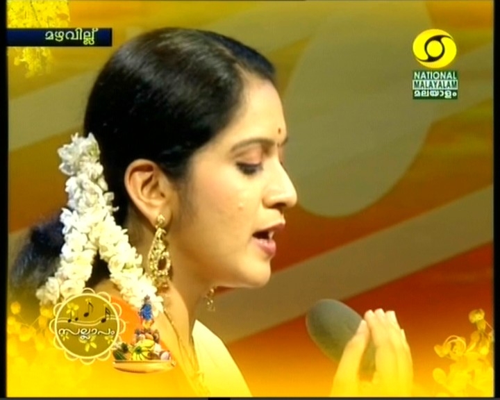 playback singer akhila anand in set saree cute images