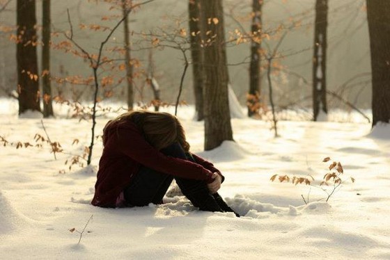 Sad alone girl on snow depressed | nineimages