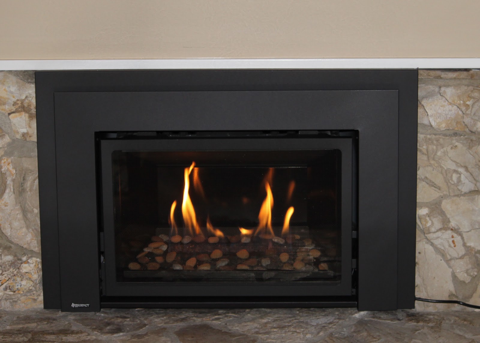 using a fireplace insert to heat a mid-century modern living room | mid ...