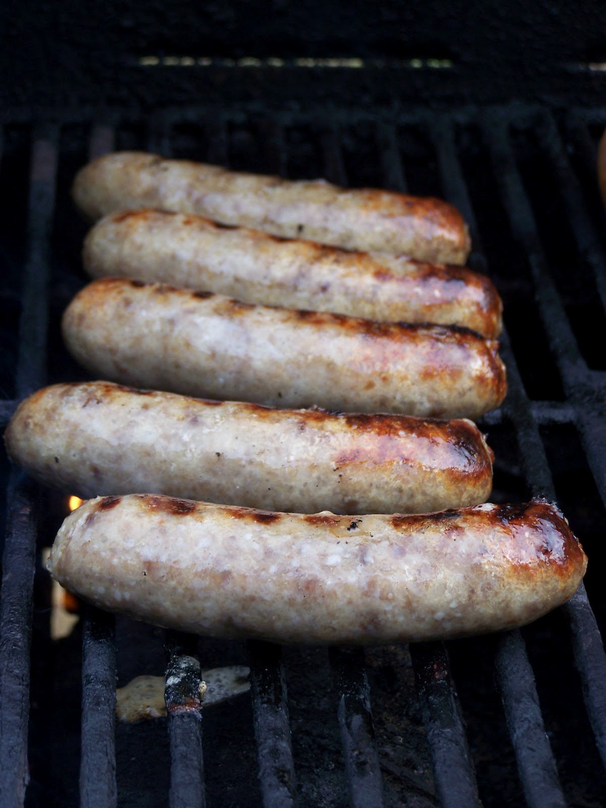 Brats Cooked in Butter, Beer and Onions