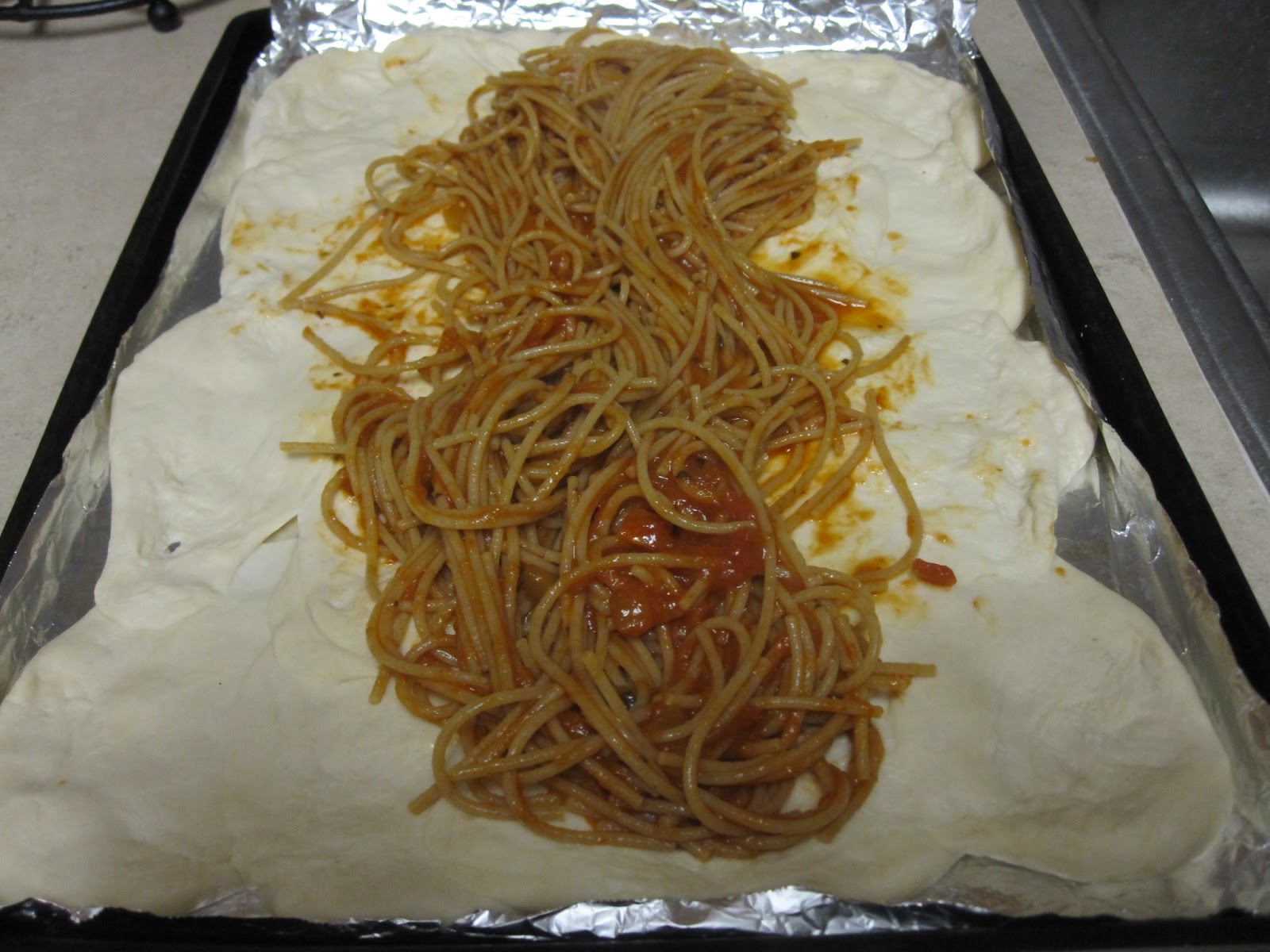 Baked Spaghetti in Garlic Bread