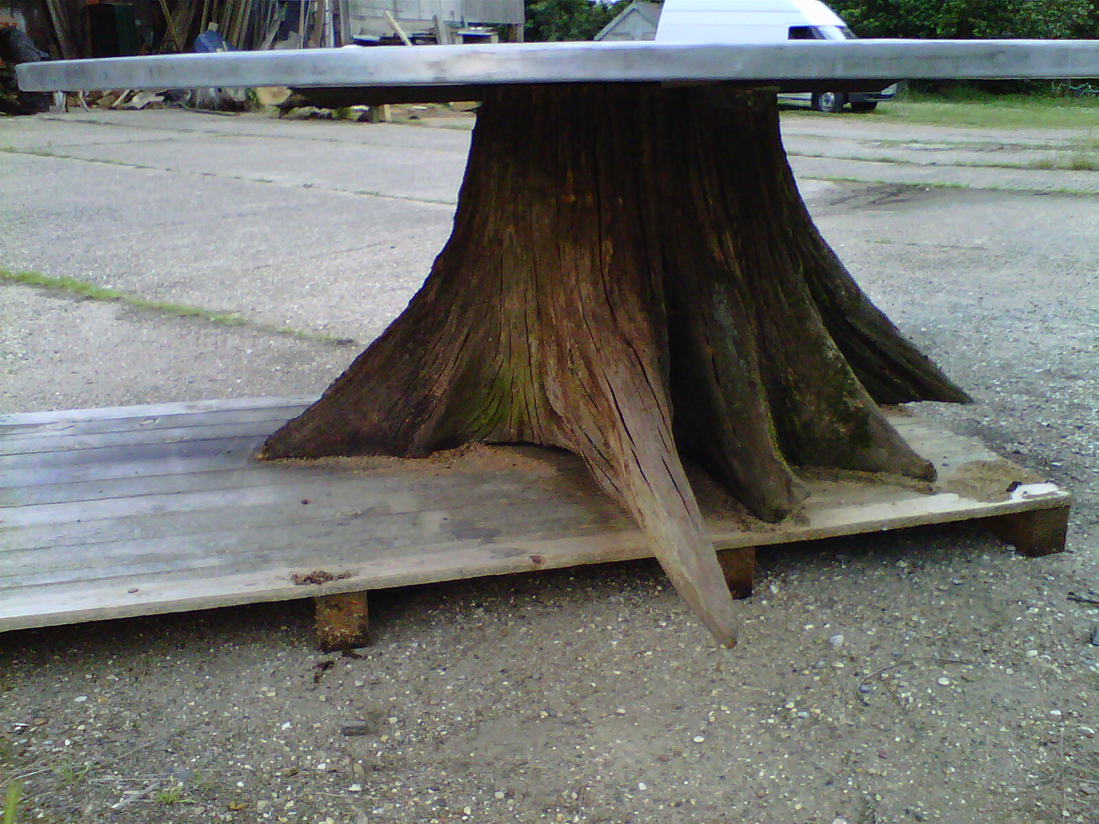Deballage Designs: Upcycled tree root table with a geometric zinc top