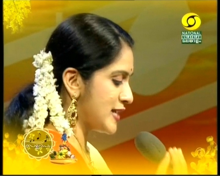 playback singer akhila anand in set saree cute images