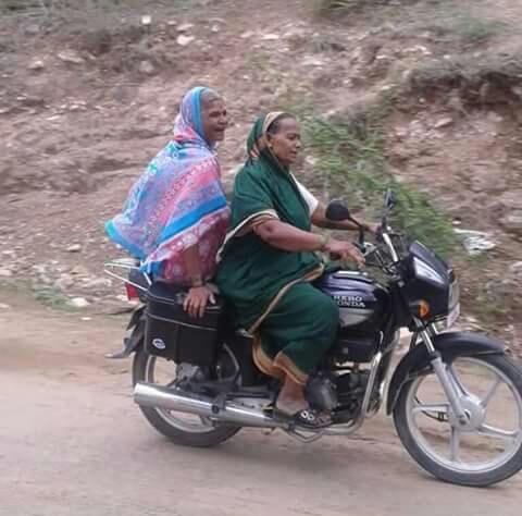 grandma bike riding in saree